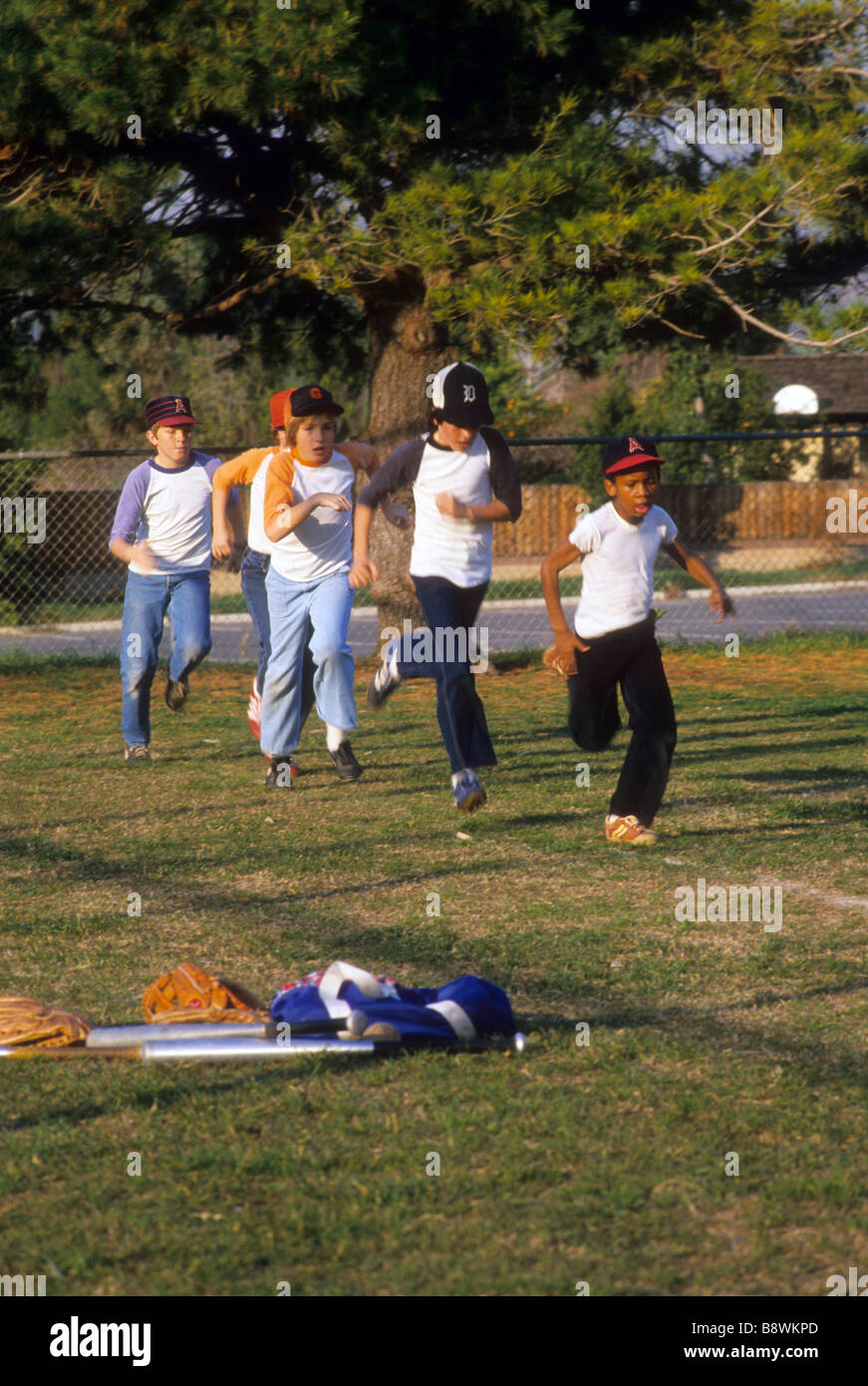 Four kid run warm up game baseball trot jog exercise stretch Stock ...