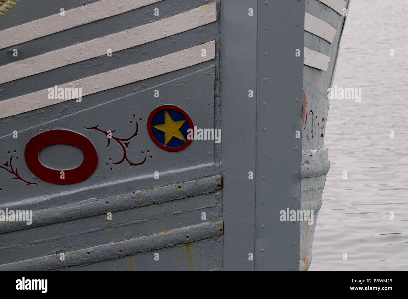 Symbols on the prow of an old boat Stock Photo - Alamy
