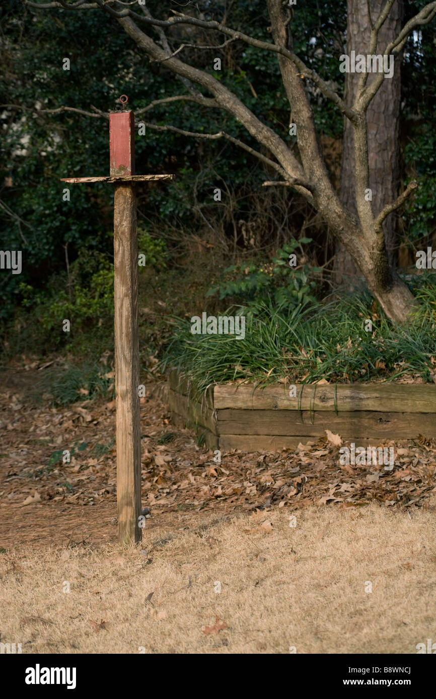 a damaged bird feeder Stock Photo - Alamy