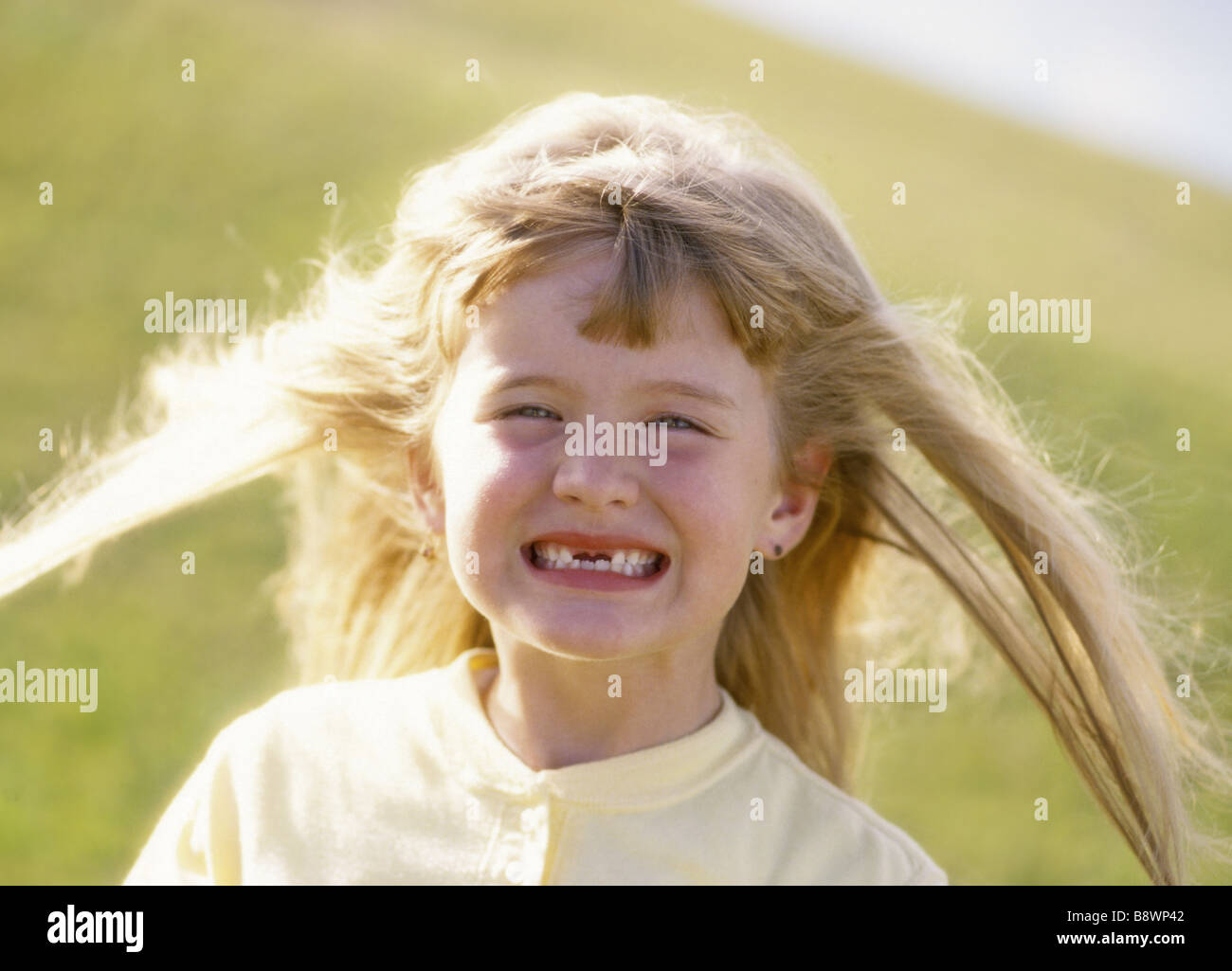 Girl without teeth smiling Stock Photo - Alamy