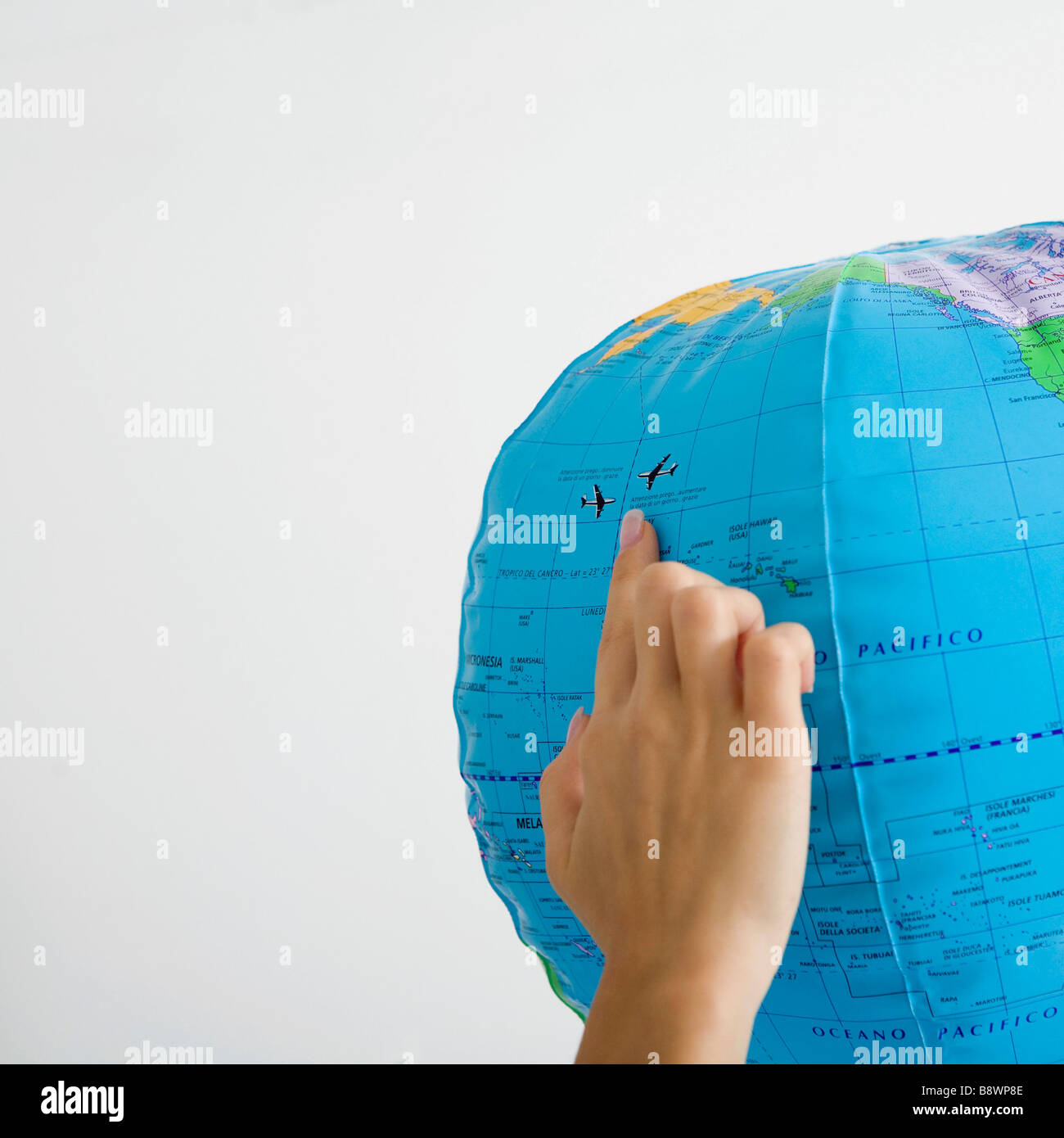 hand over the globe Stock Photo - Alamy