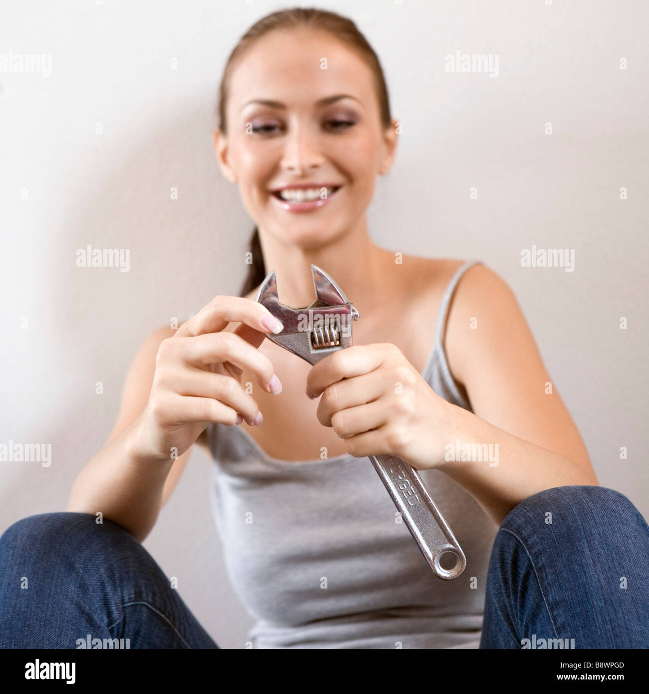 woman with wrench Stock Photo - Alamy