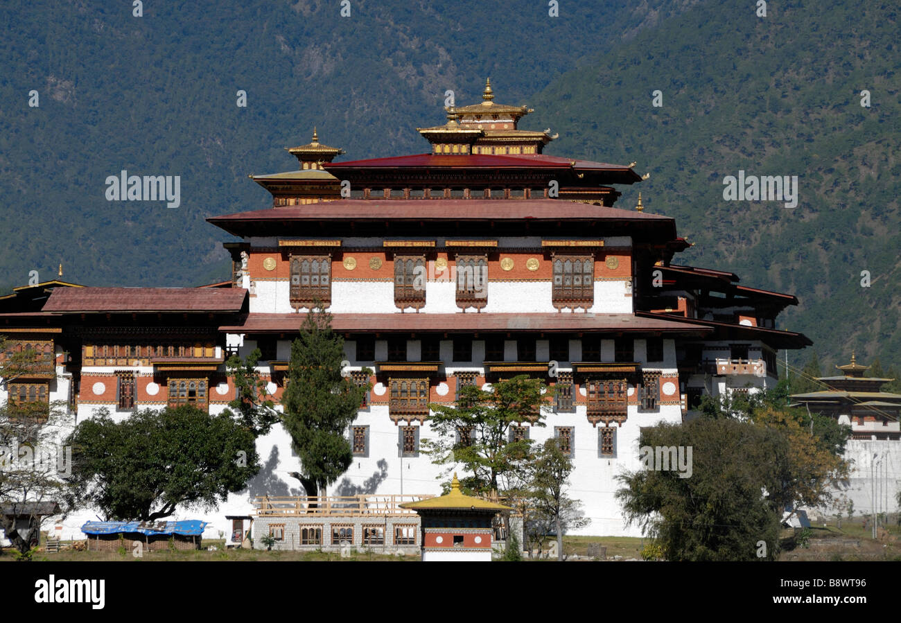 The vast whitewashed stone walls and ornate roof of Punakha Dzong ...