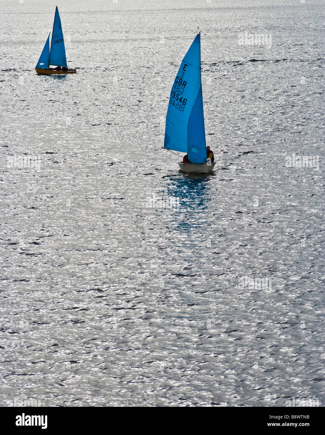 Yachts with blue sails on the sea off the northern England coast Stock ...