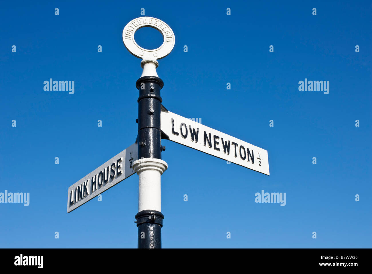 Traditional metal road direction sign erected by the Northumberland ...