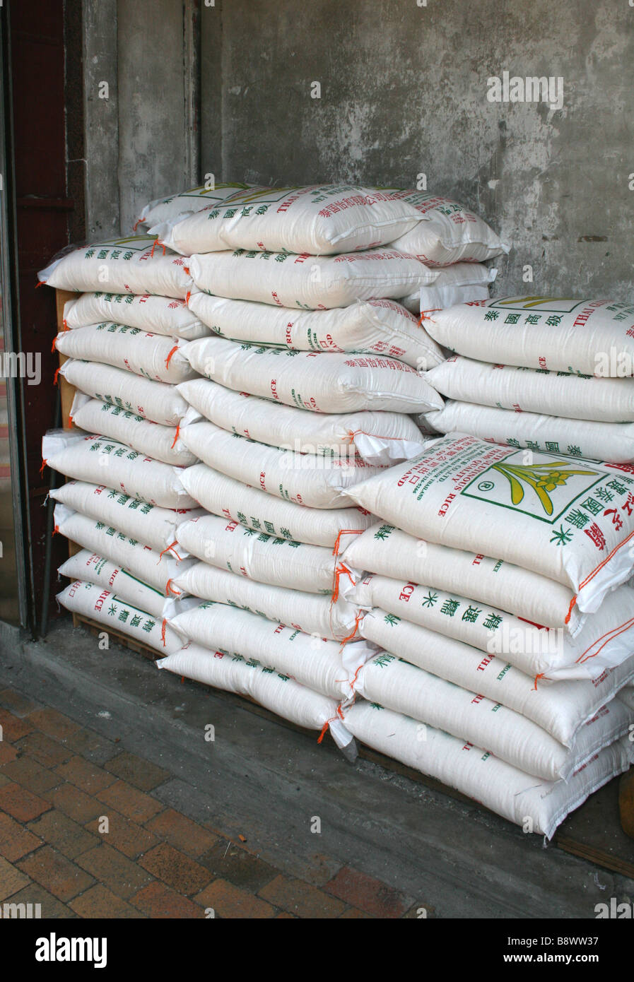 stacks of sacks of rice Hong Kong April 2008 Stock Photo - Alamy