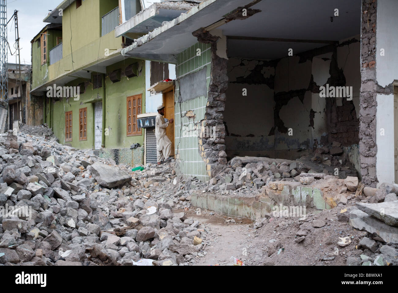 Ruins of buildings in a street in central Muzaffarabad, Pakistan ...