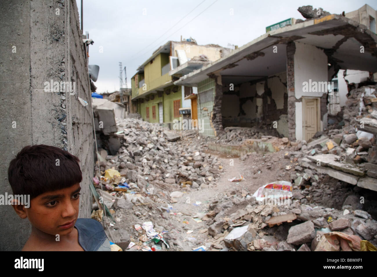 Ruins of buildings in a street in central Muzaffarabad, Pakistan ...