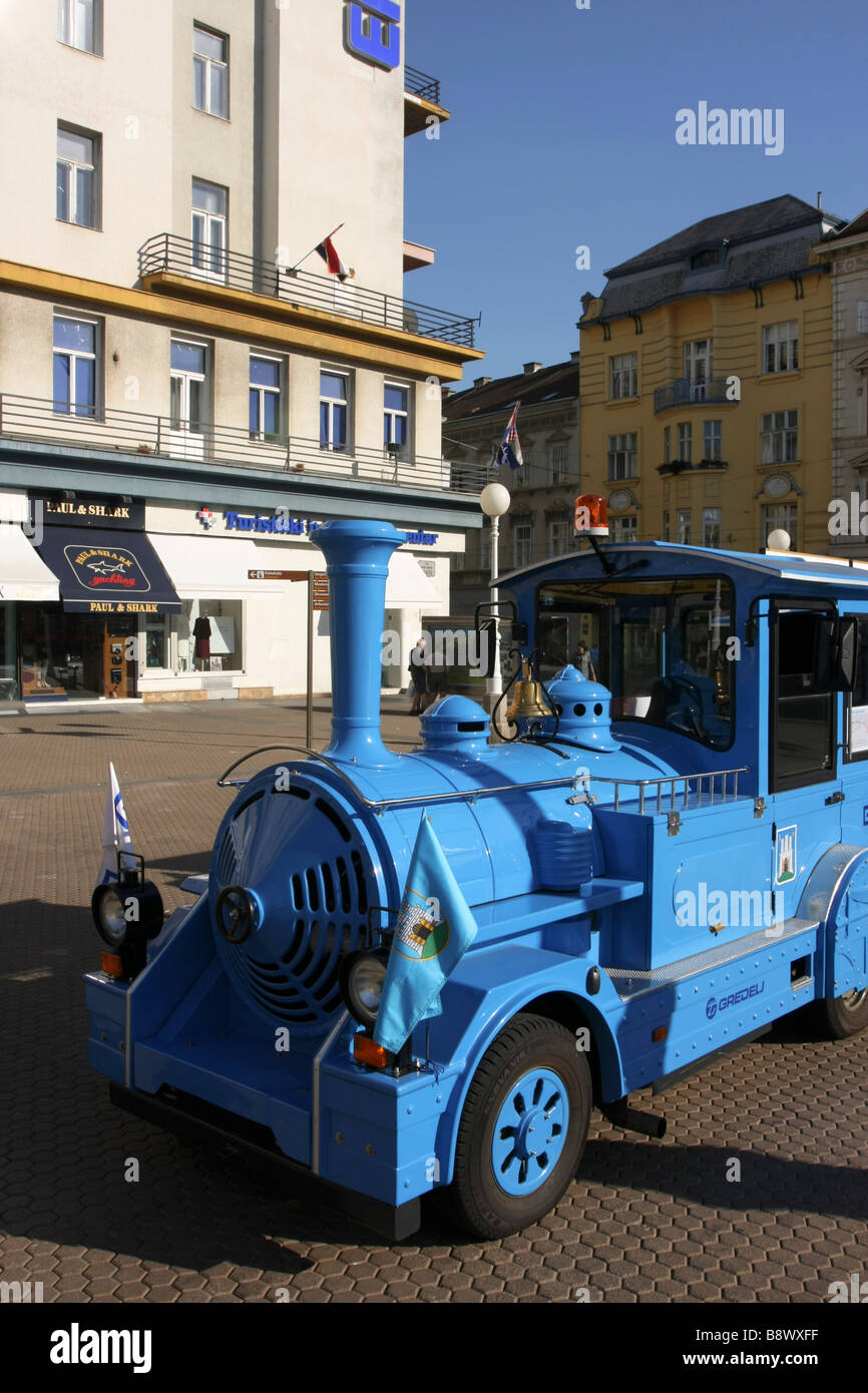 Blue tourist train waits outside the information center in Zagreb ...