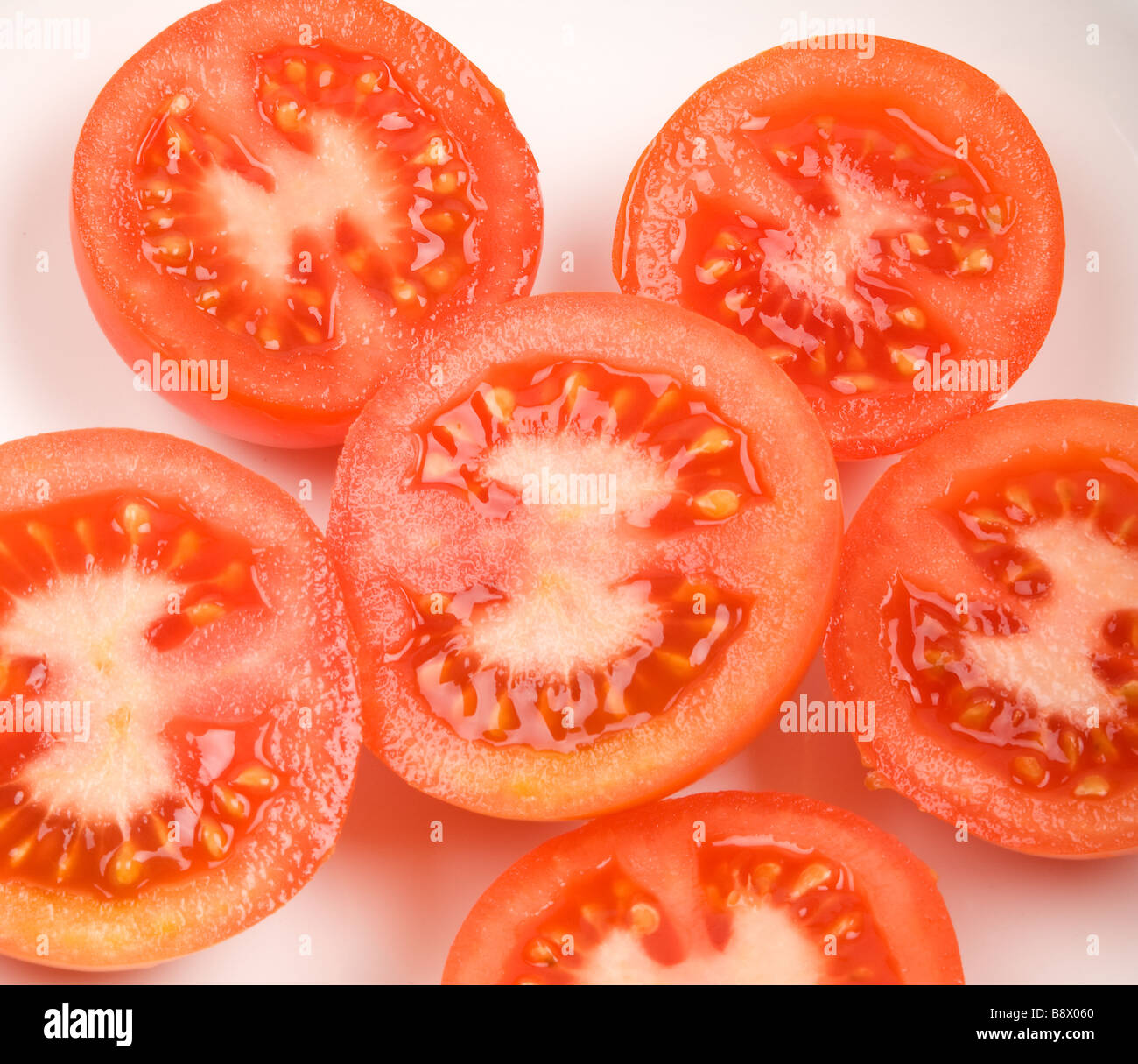 A close up shot of a cross section of several fresh red tomatoes Stock ...