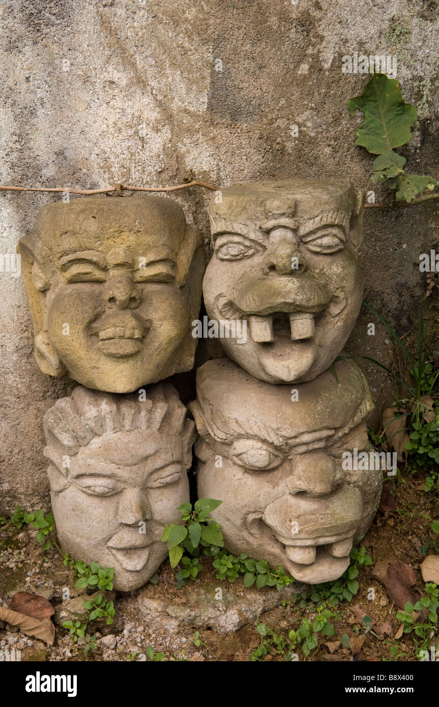 Stone statue of funny faces,Ubud,Bali,Indonesia Stock Photo - Alamy