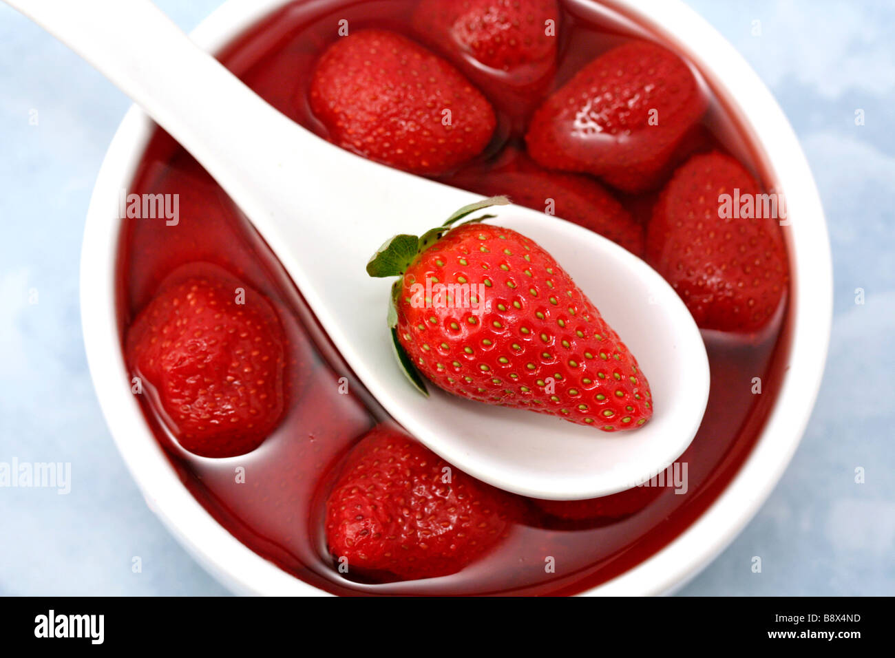 Strawberries in syrup Stock Photo - Alamy