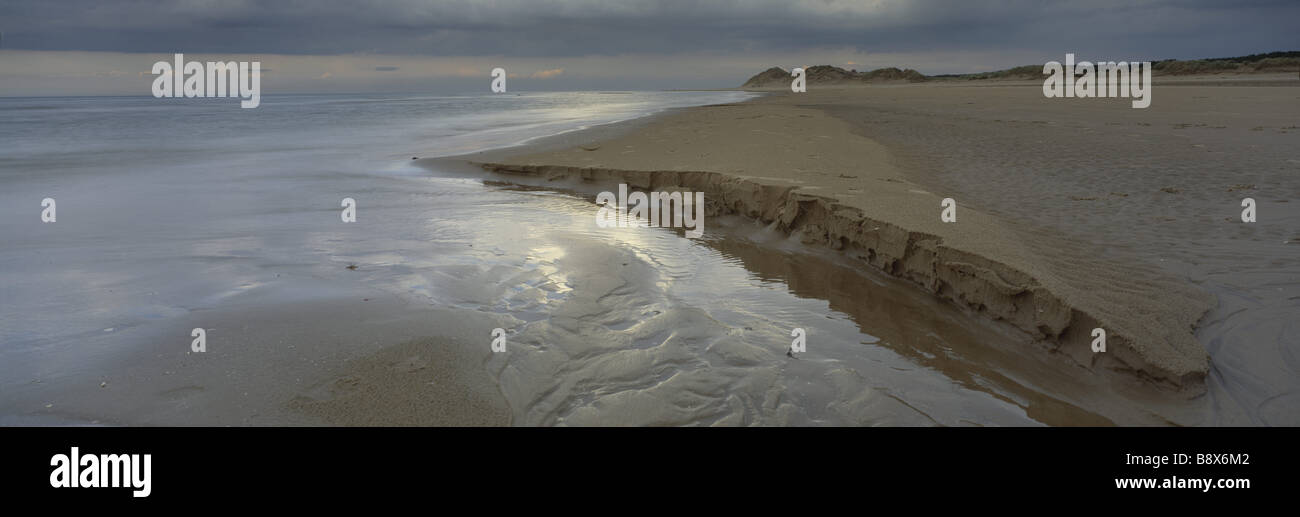 The foreshore at Formby Point with a sand ledge dropping into the water ...