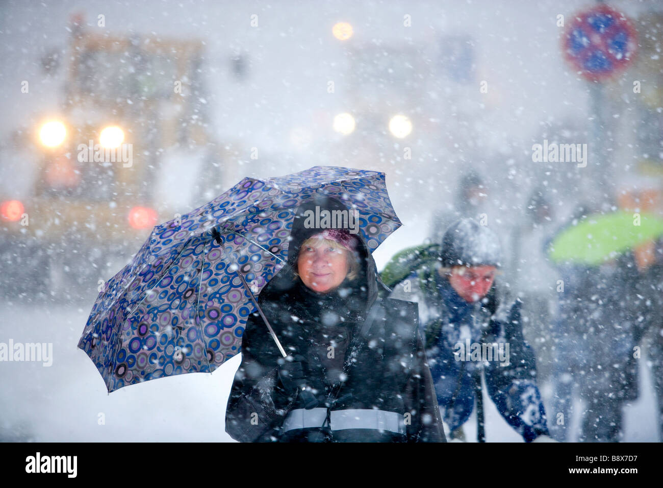 Umbrella in snowstorm For editorial use only Stock Photo - Alamy