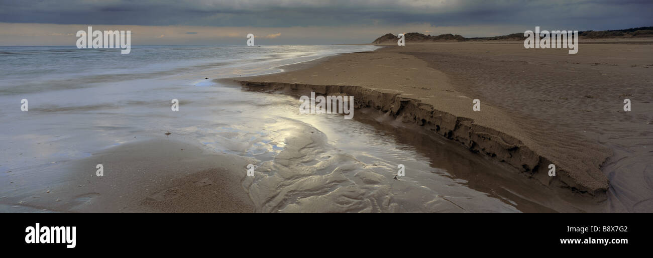 A striking image of the vast foreshore at Formby Point with sunlight ...