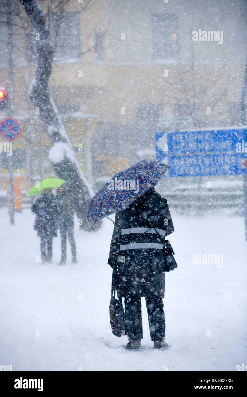 Umbrella in snowstorm For editorial use only Stock Photo - Alamy