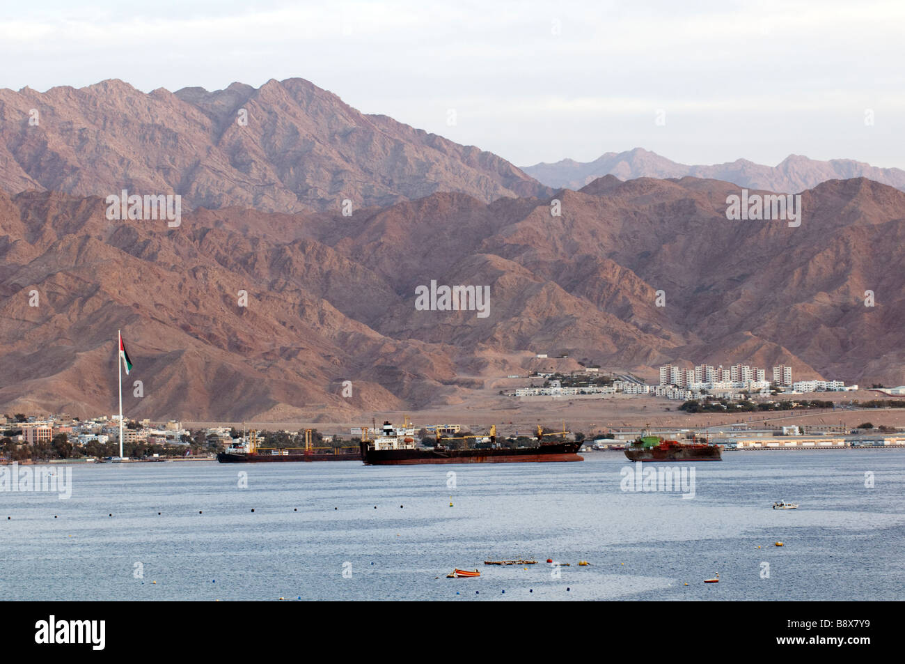 The Jordanian port cityof Aqaba at dawn, viewed from Eilat Stock Photo ...