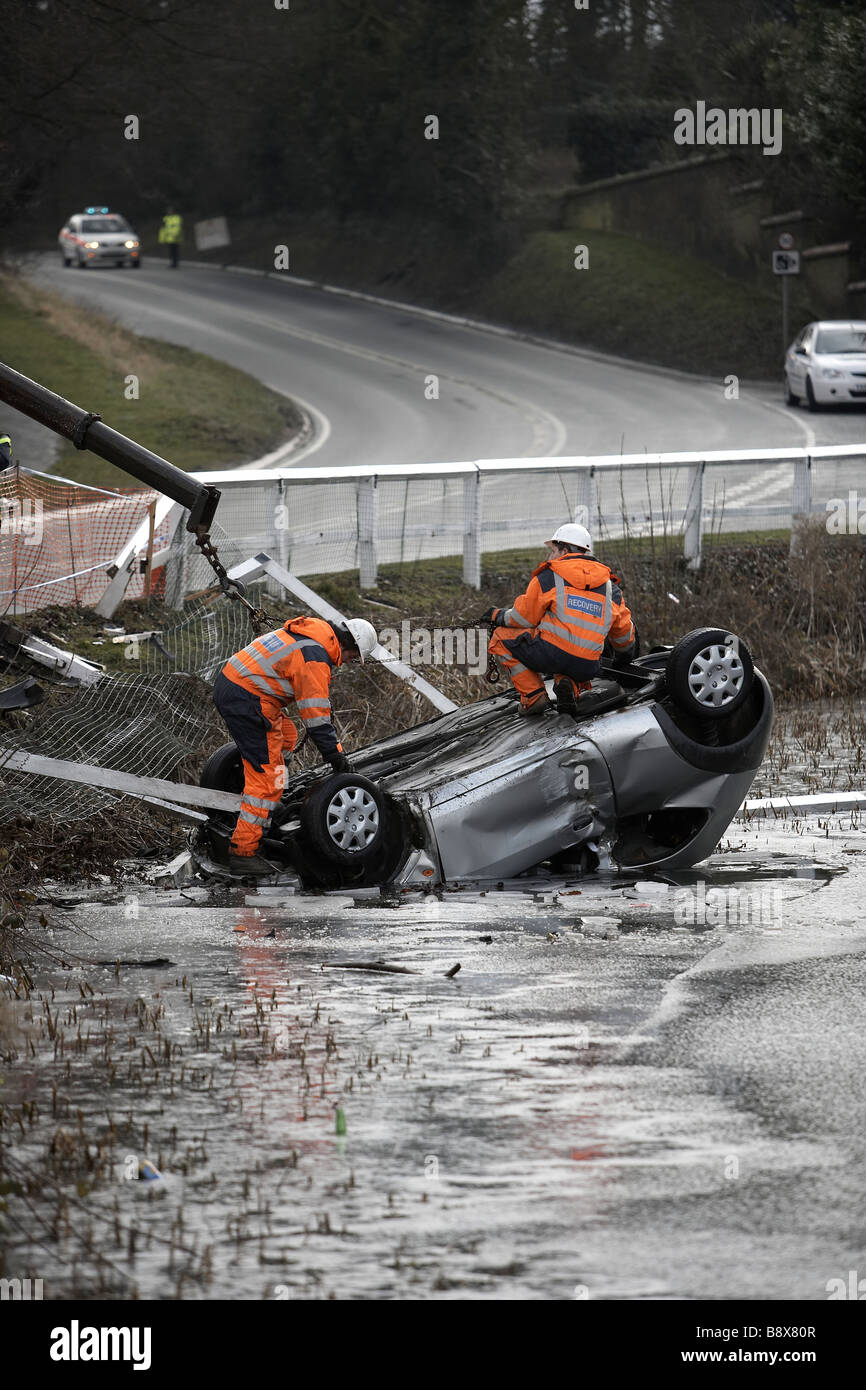 Vehicle recovery car crash from frozen pond Stock Photo - Alamy