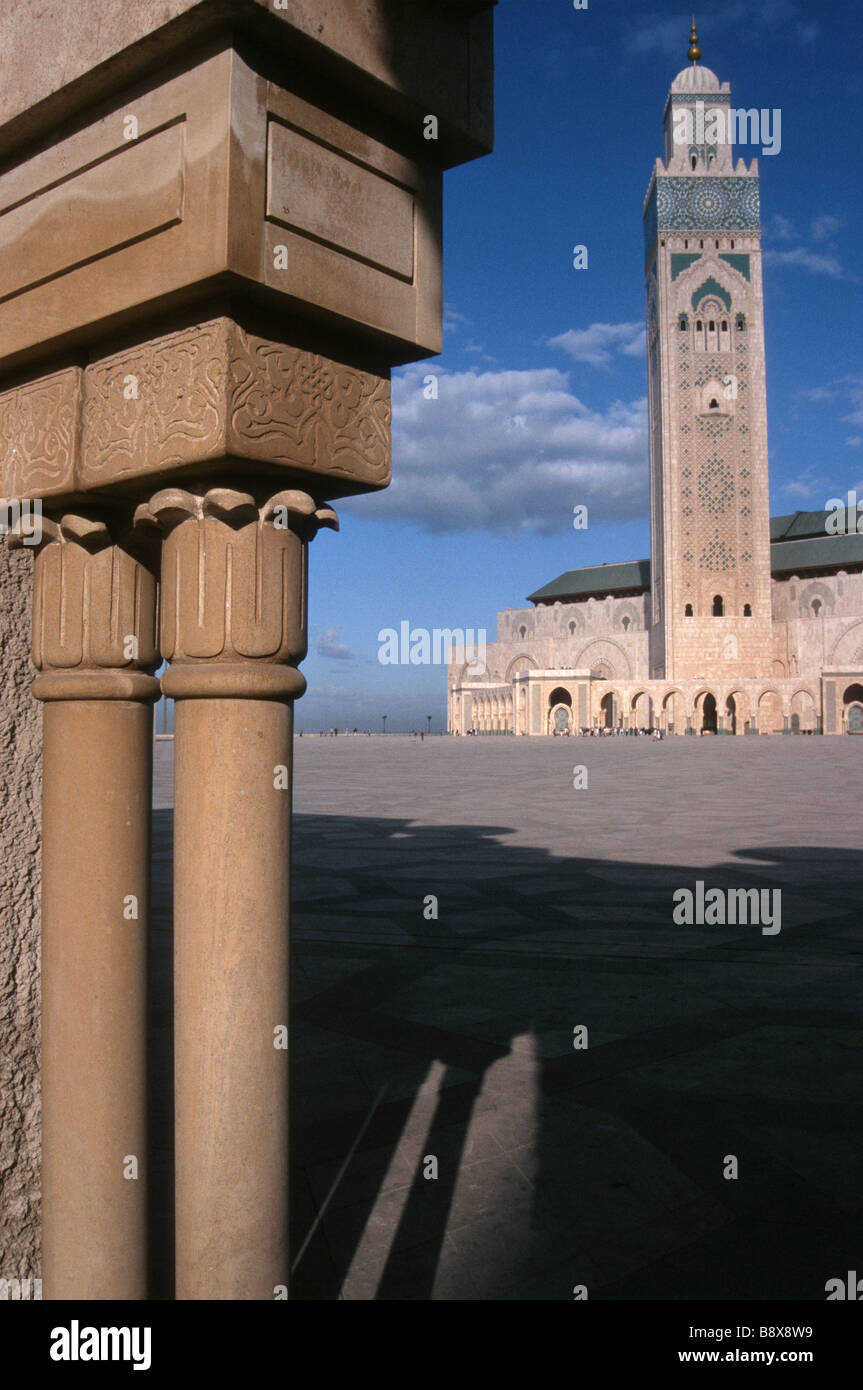 pillars with arab patterns in the foreground and mosque Hassan II in ...