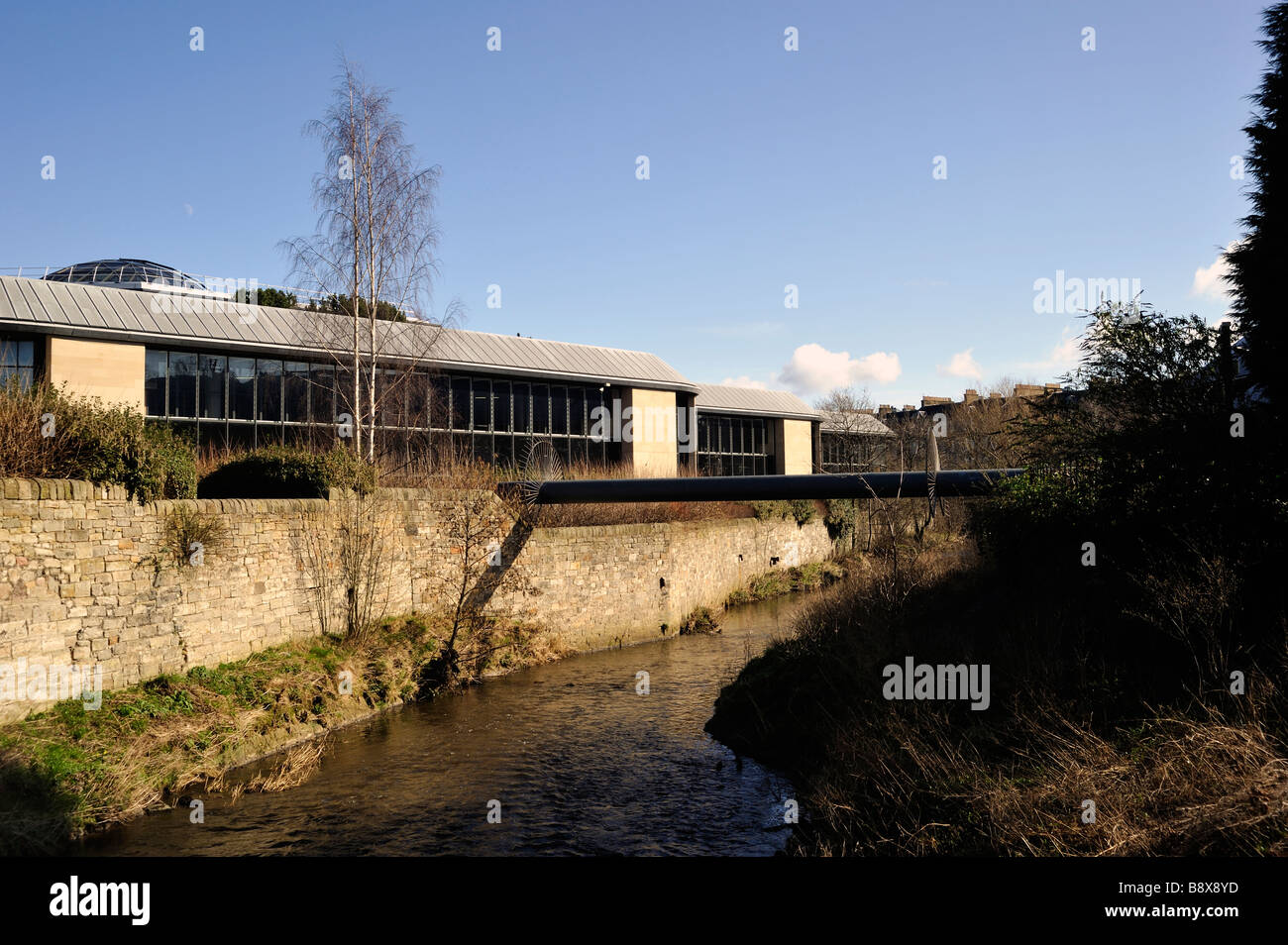 An office building next to a river Stock Photo - Alamy