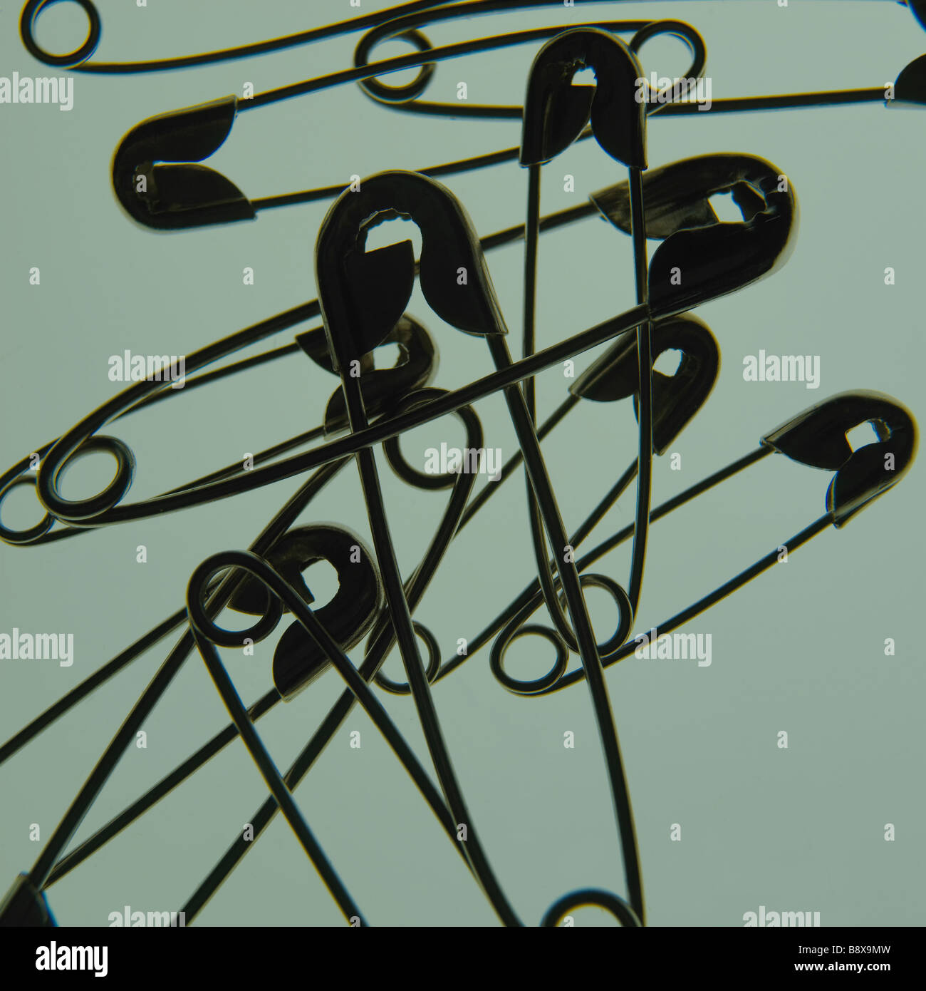 A contemporary set of different sized safety pins Stock Photo - Alamy