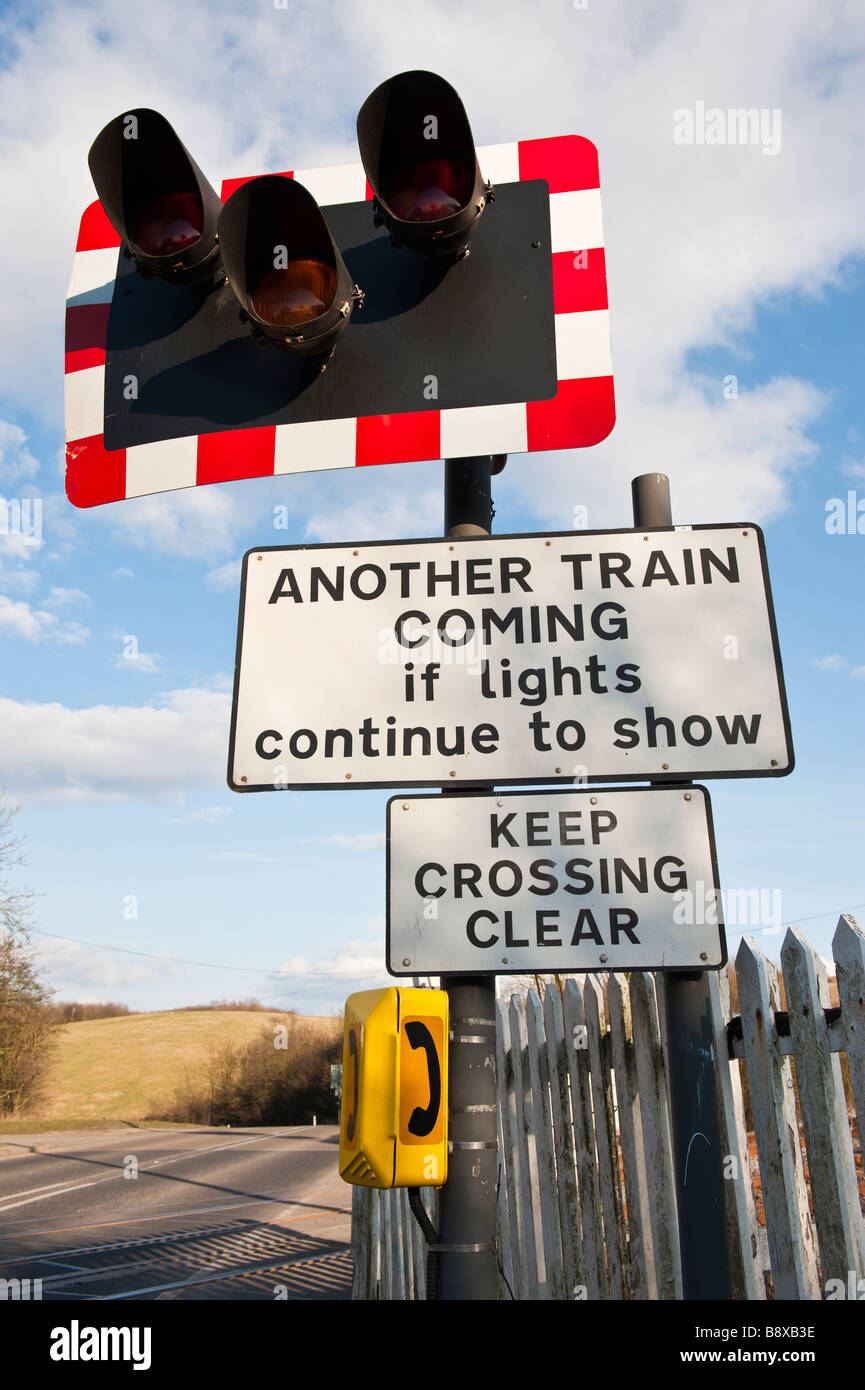 Railway crossing at the junction of a train track and road. Kirkby In ...