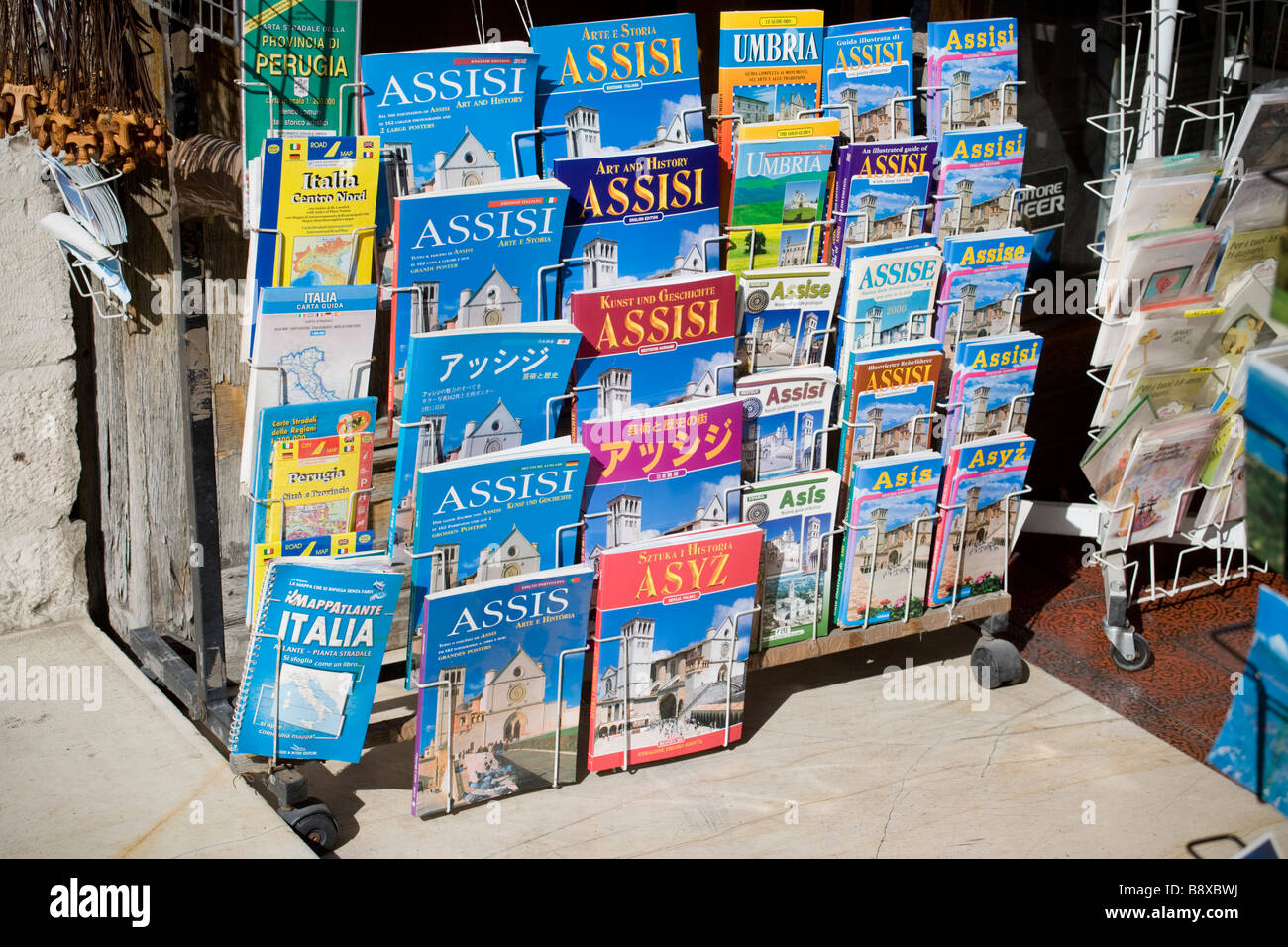 Rack displaying guide books to assisi and italian maps hi-res stock ...