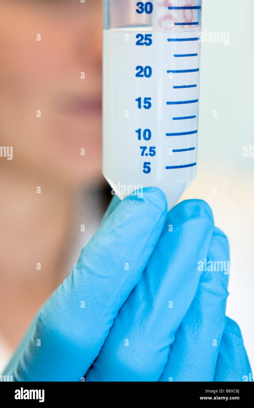 Solution in graduated measuring tube hi-res stock photography and ...