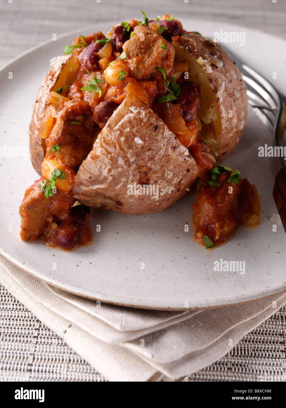 A jacket potato with BBQ Pork and beans Stock Photo - Alamy