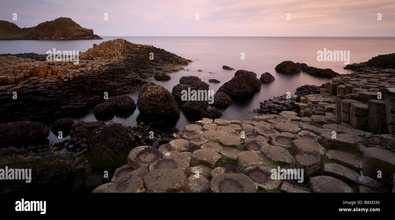View of the pinky coloured sea with interesting rock formations in the ...