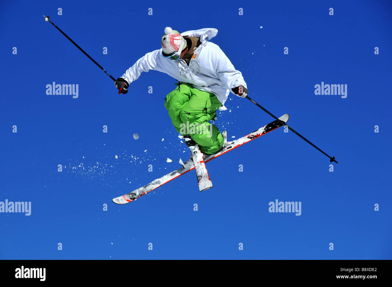 skier jumping with crossed skis Stock Photo - Alamy