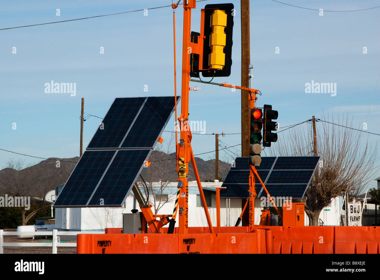 temporary solar powered traffic control lights at a street intersection ...