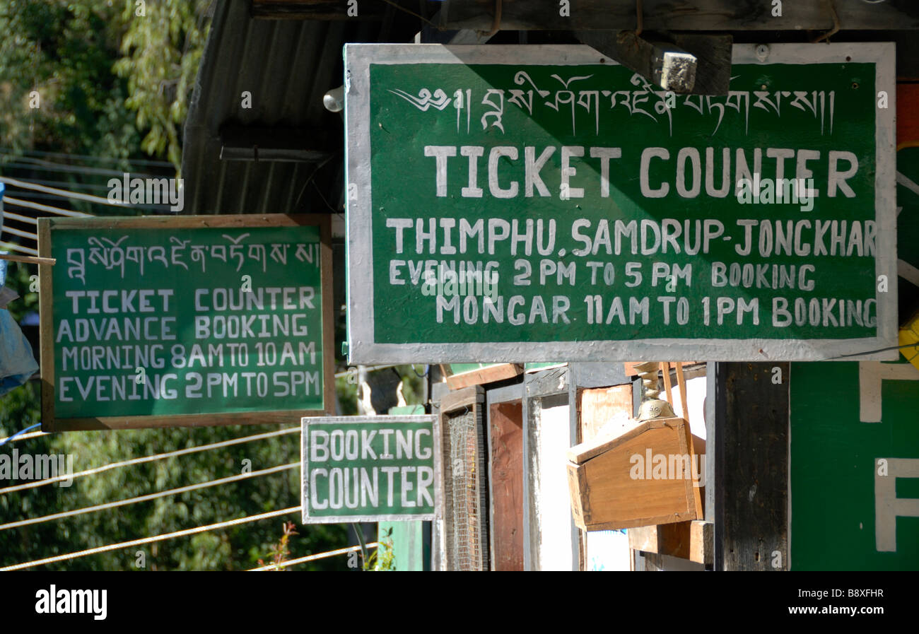Green and white hand painted signs at the bus ticket office in ...
