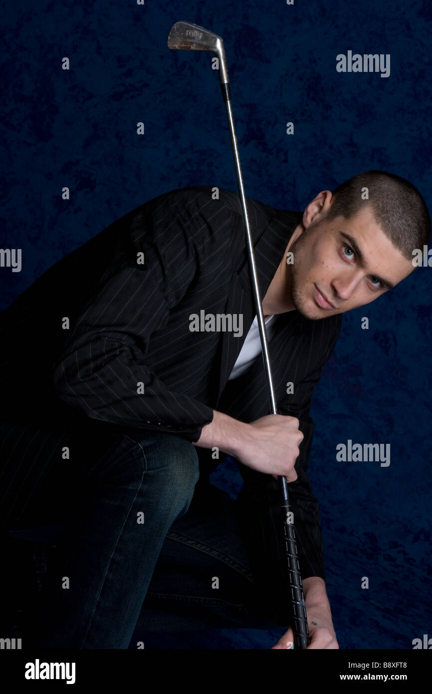 man looking menacing at camera against blue background Stock Photo - Alamy