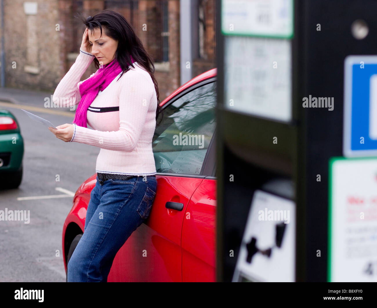 Woman with parking ticket Stock Photo - Alamy
