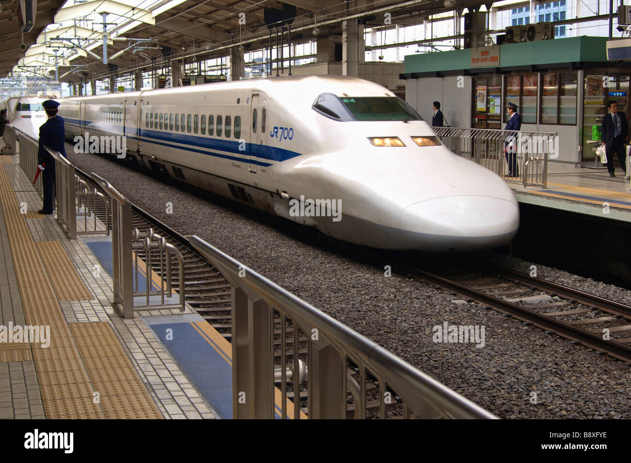Platform Guard at Kyoto Station signalling the arrival of the ...