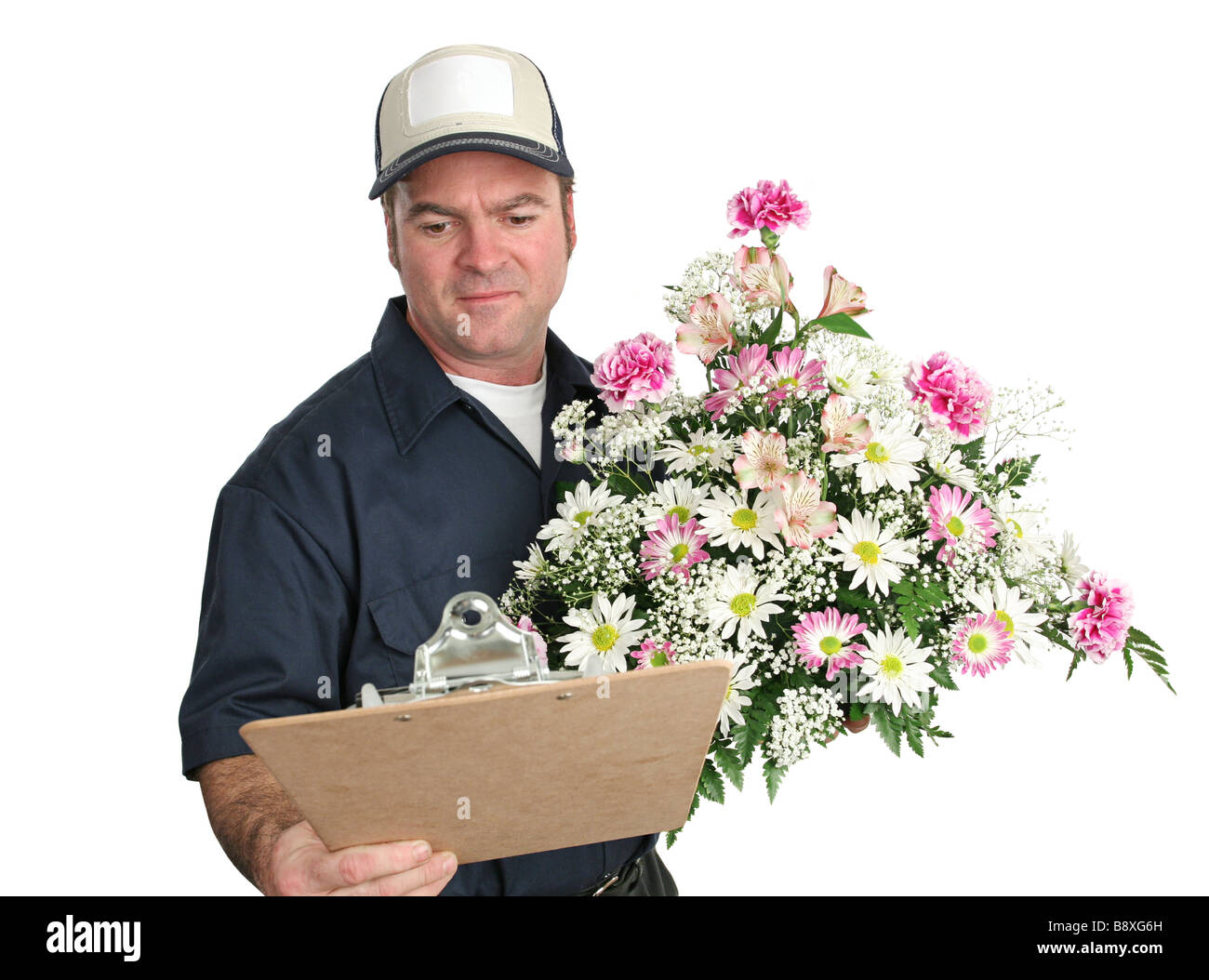 A flower delivery man checking directions on his clipboard Stock Photo ...
