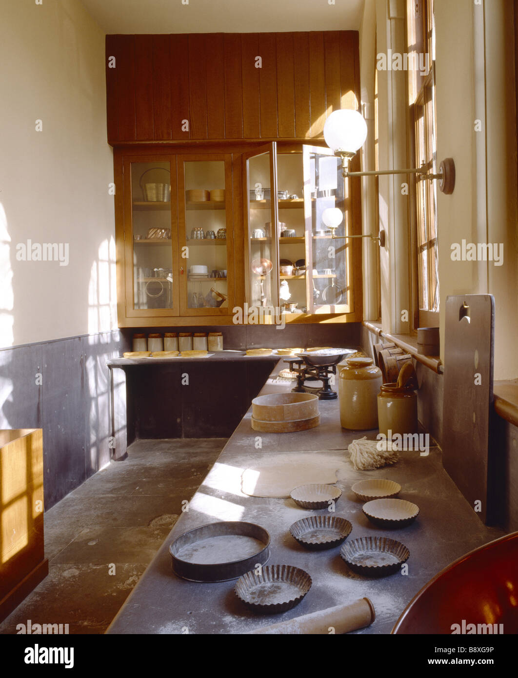 Pastry room showing slate benches with pastry and tins sieve and ...
