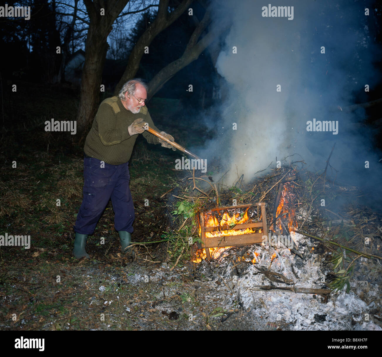 Man with a bonfire Stock Photo - Alamy