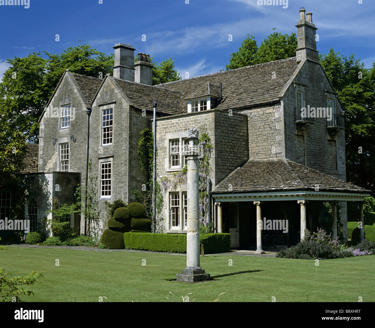 A view of the main house at The Courts with a monument in the ...
