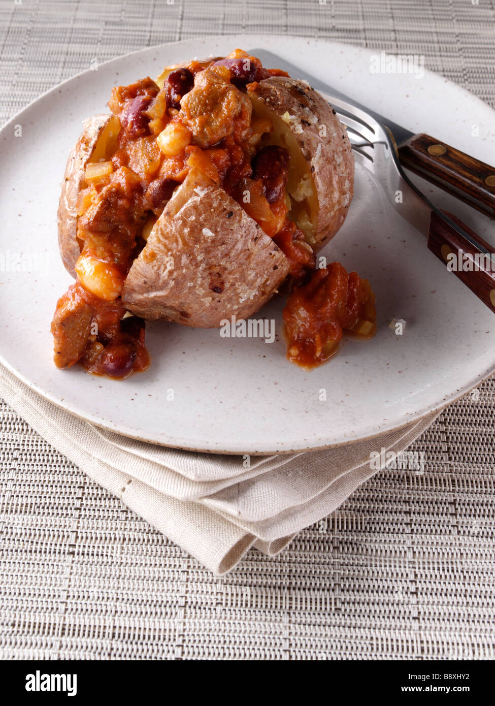 A jacket potato with BBQ Pork and beans Stock Photo - Alamy
