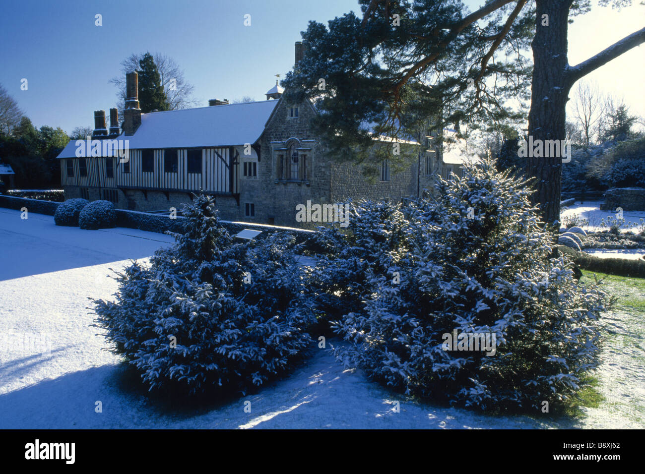 The north west aspect of Ightham Mote after early morning snow The low ...