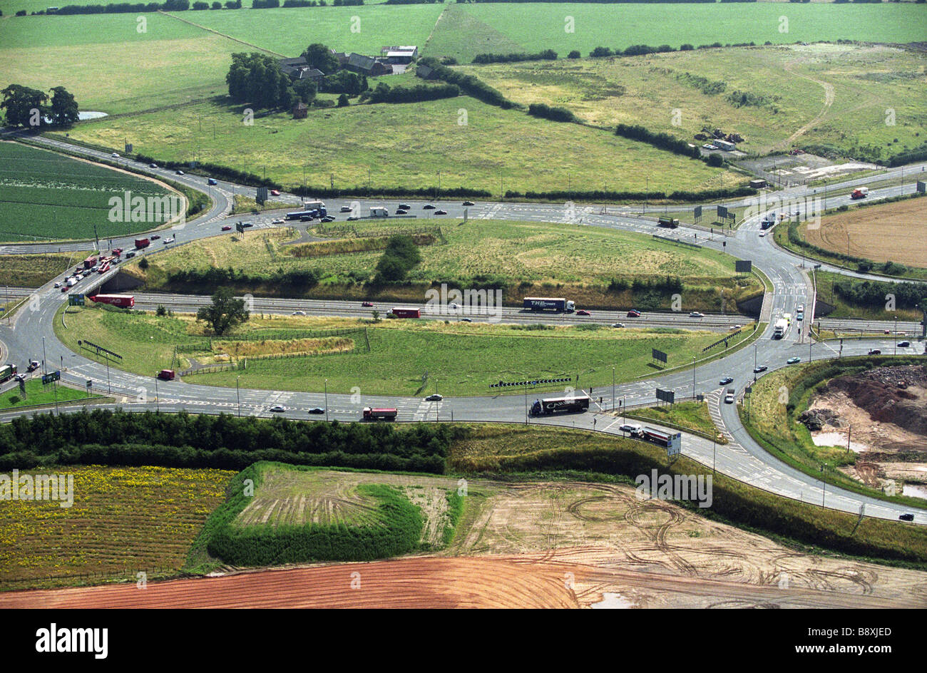 Aerial view of the M6 Toll Road motorway under construction next to the ...