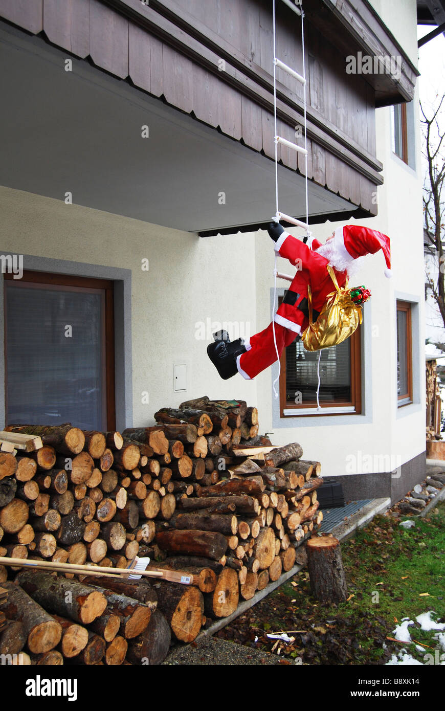 Santa Claus climbing Austrian balcony Stock Photo - Alamy