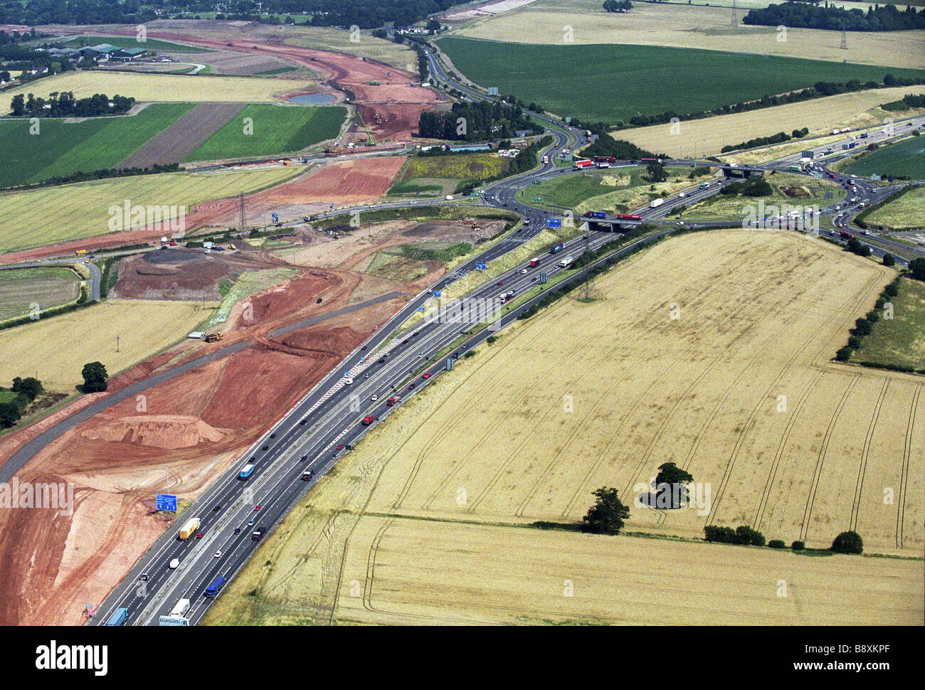 Aerial view of the M6 Toll Road motorway under construction next to the ...
