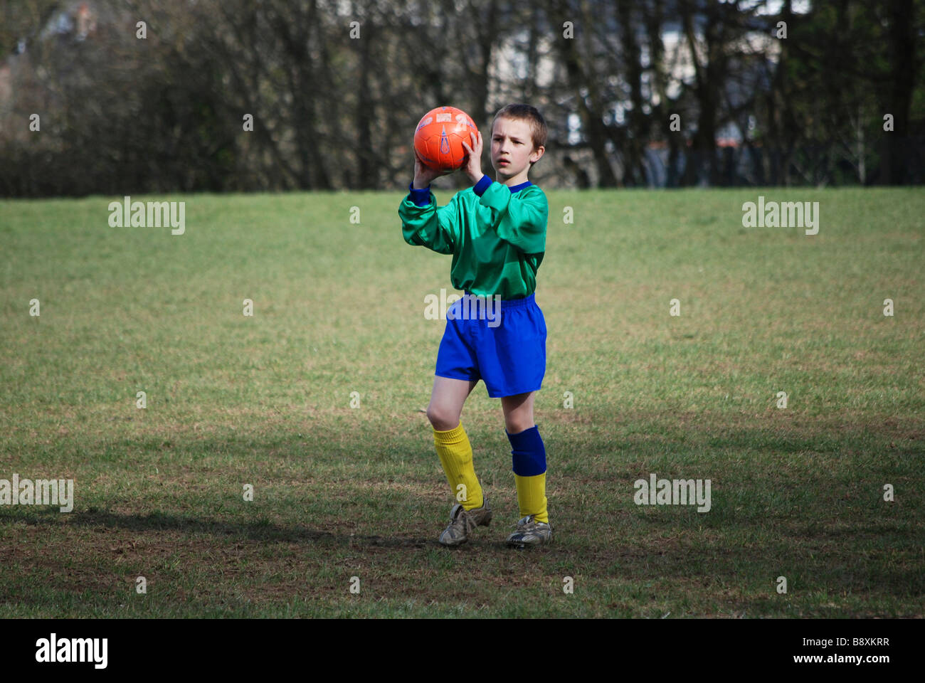 a young boy about to take a throw in during a football match Stock ...