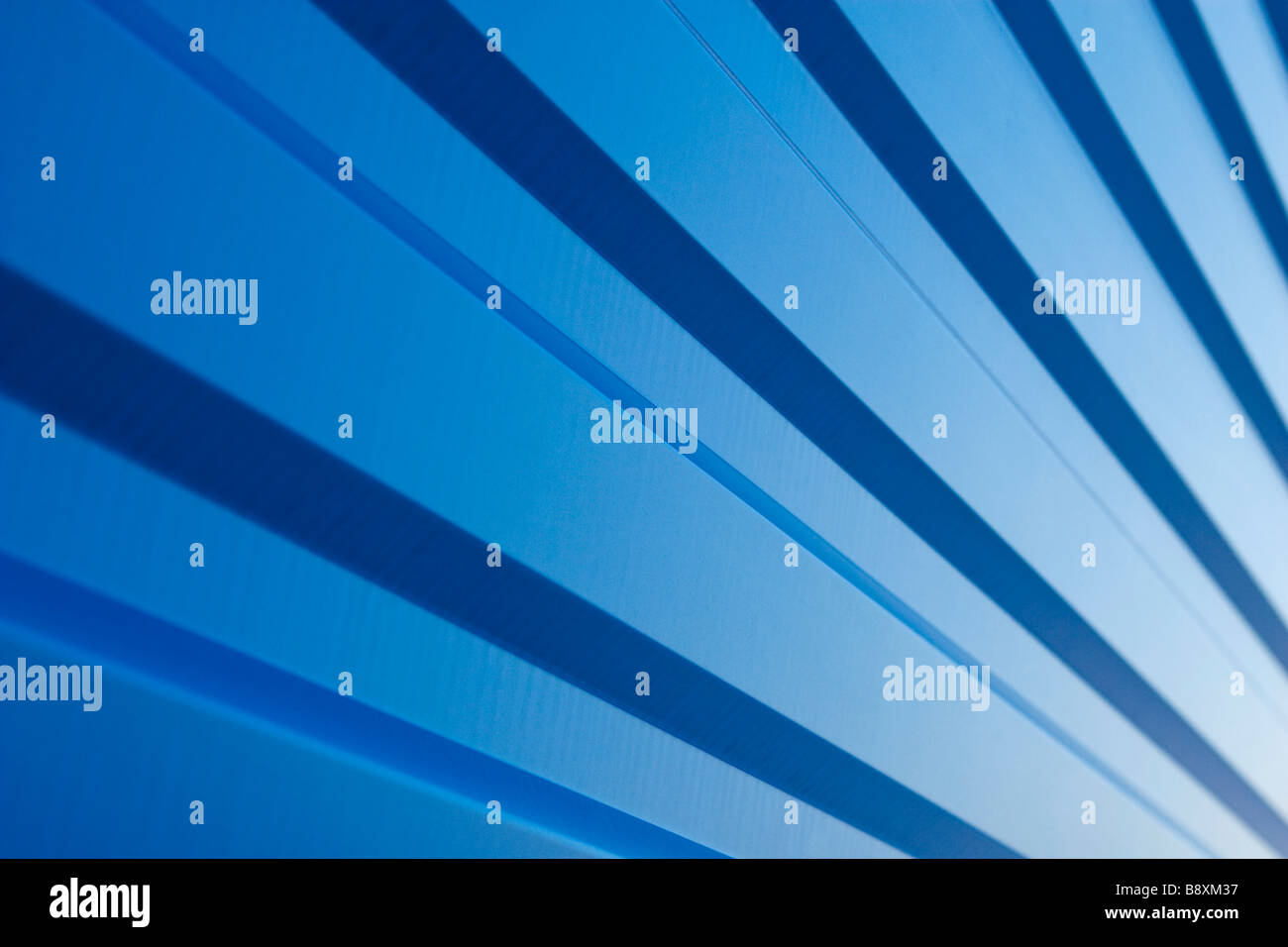 Waved blue metal sheet pattern on sunset Stock Photo - Alamy