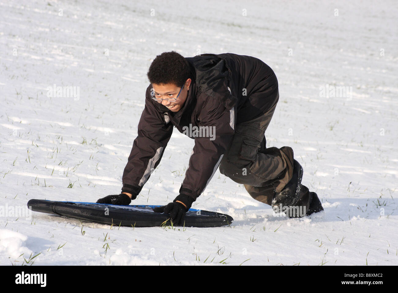 snowboard boy black ethnic happy smile playing snow ice top young ...