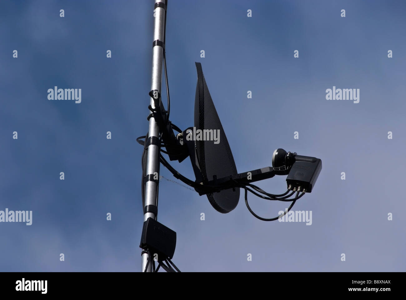 A satellite digital television arial on a roof Stock Photo - Alamy