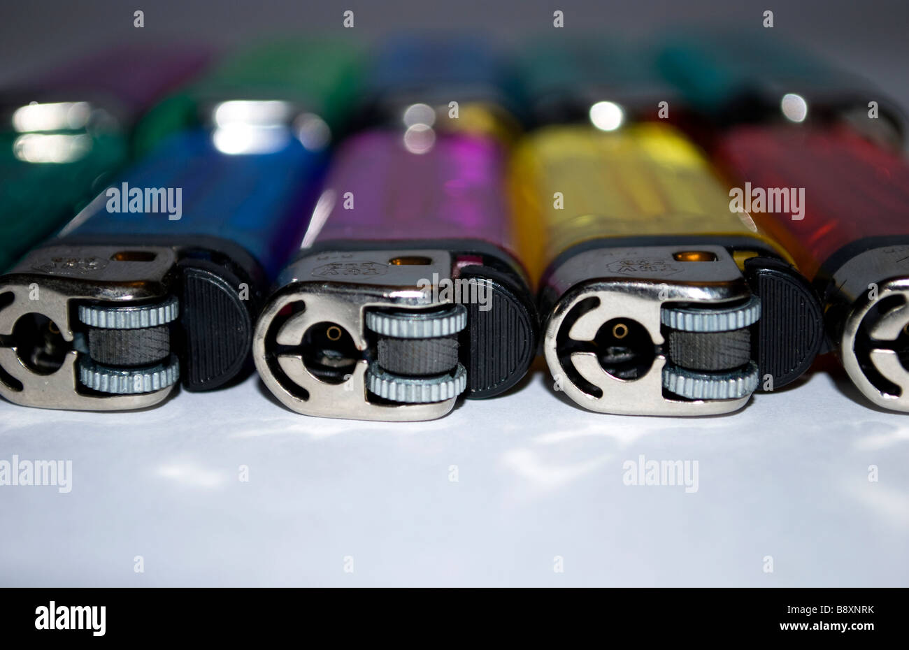 Lighters laying in a row Stock Photo - Alamy